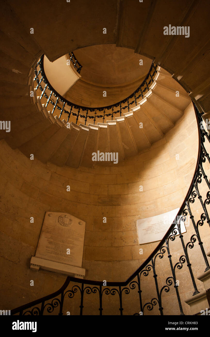 Round spiral staircase made from old stone in library Stock Photo - Alamy