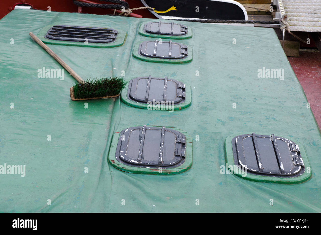Green hatches and deck brush Moored barge Hythe Quay Maldon Essex ...