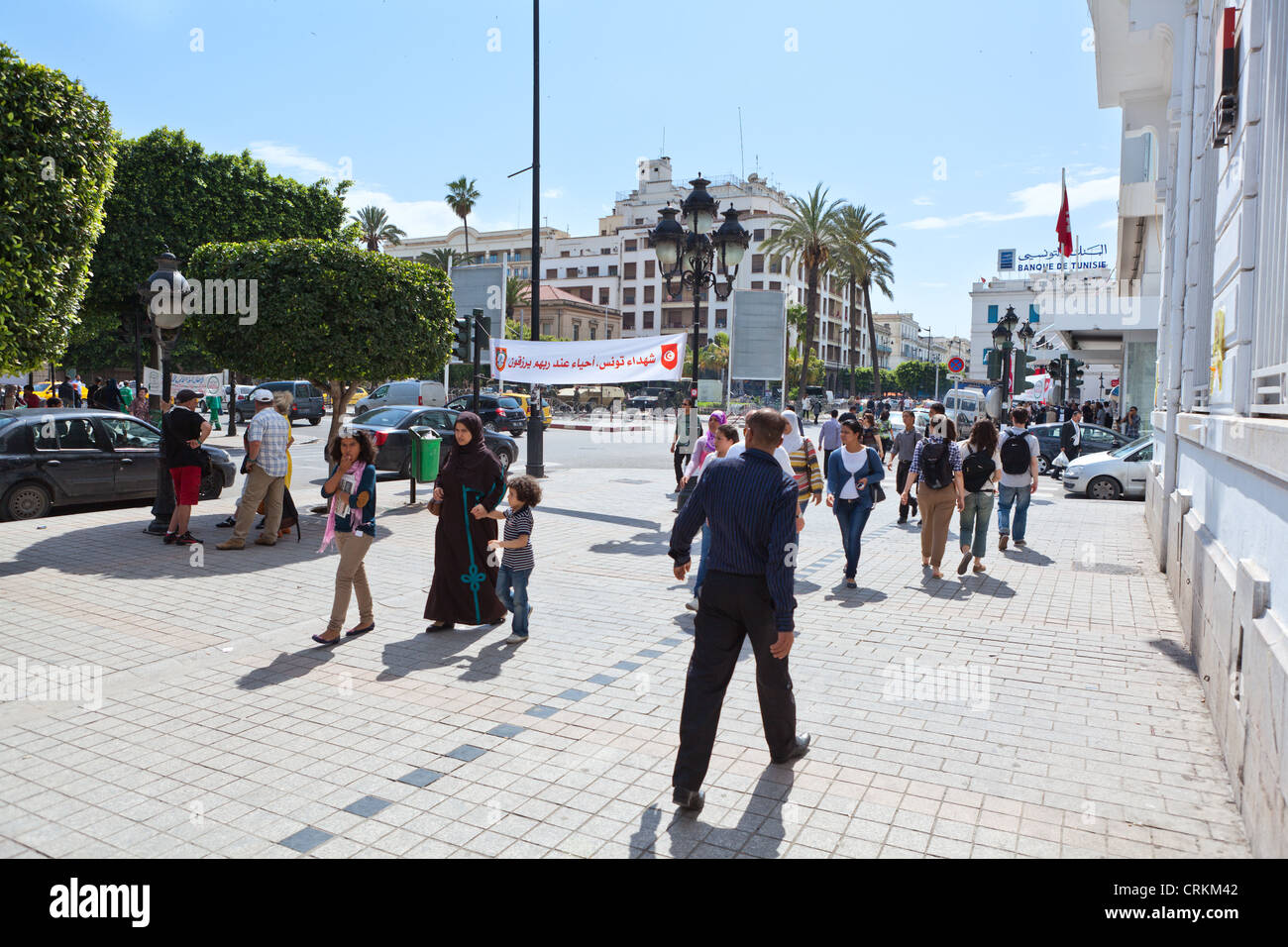 Tunisian people walking on the pavement in the Tunis city in Tunisia ...