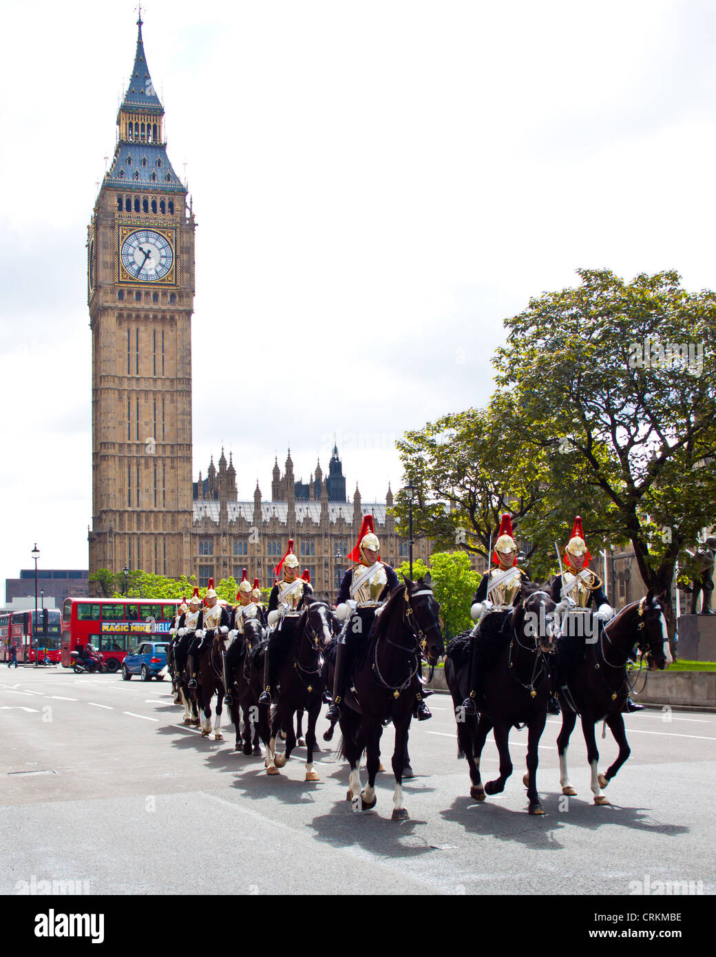 Household Cavalry ride in front of Westminster palace with a TFL red ...