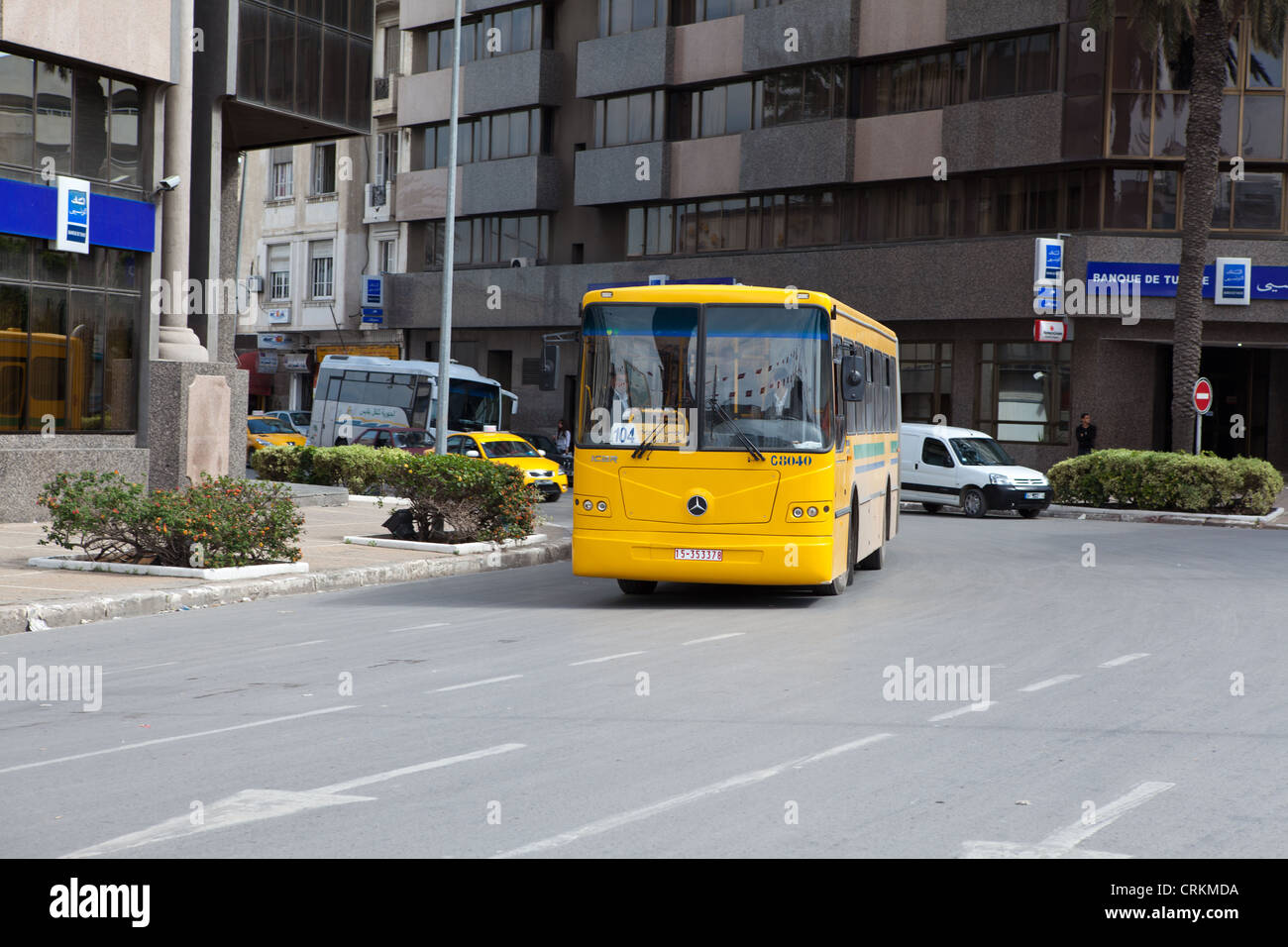 City public yellow bus on streets of capital Tunis of Tunisia, Africa ...