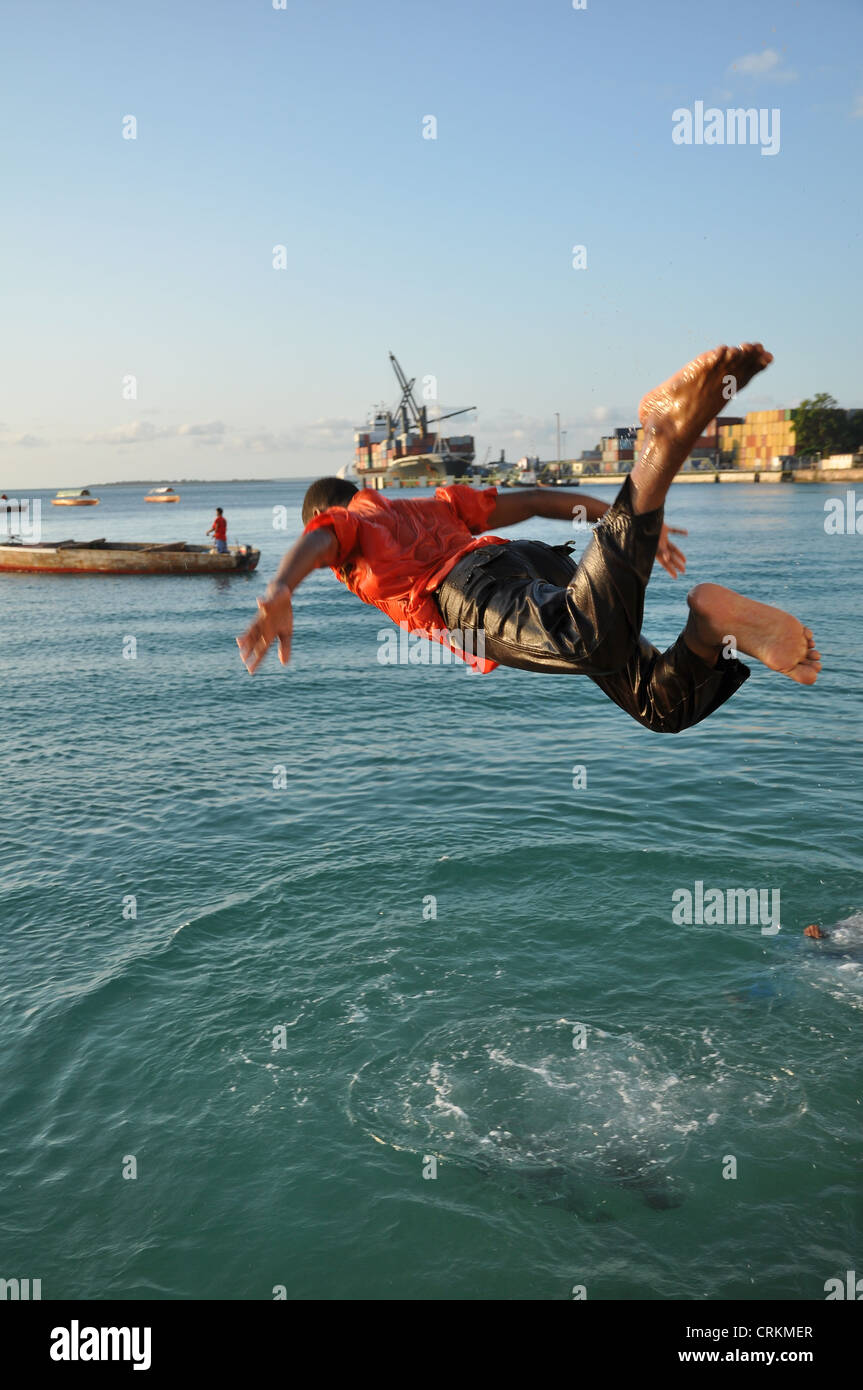 African boys diving in Stone town, zanzibar Stock Photo - Alamy