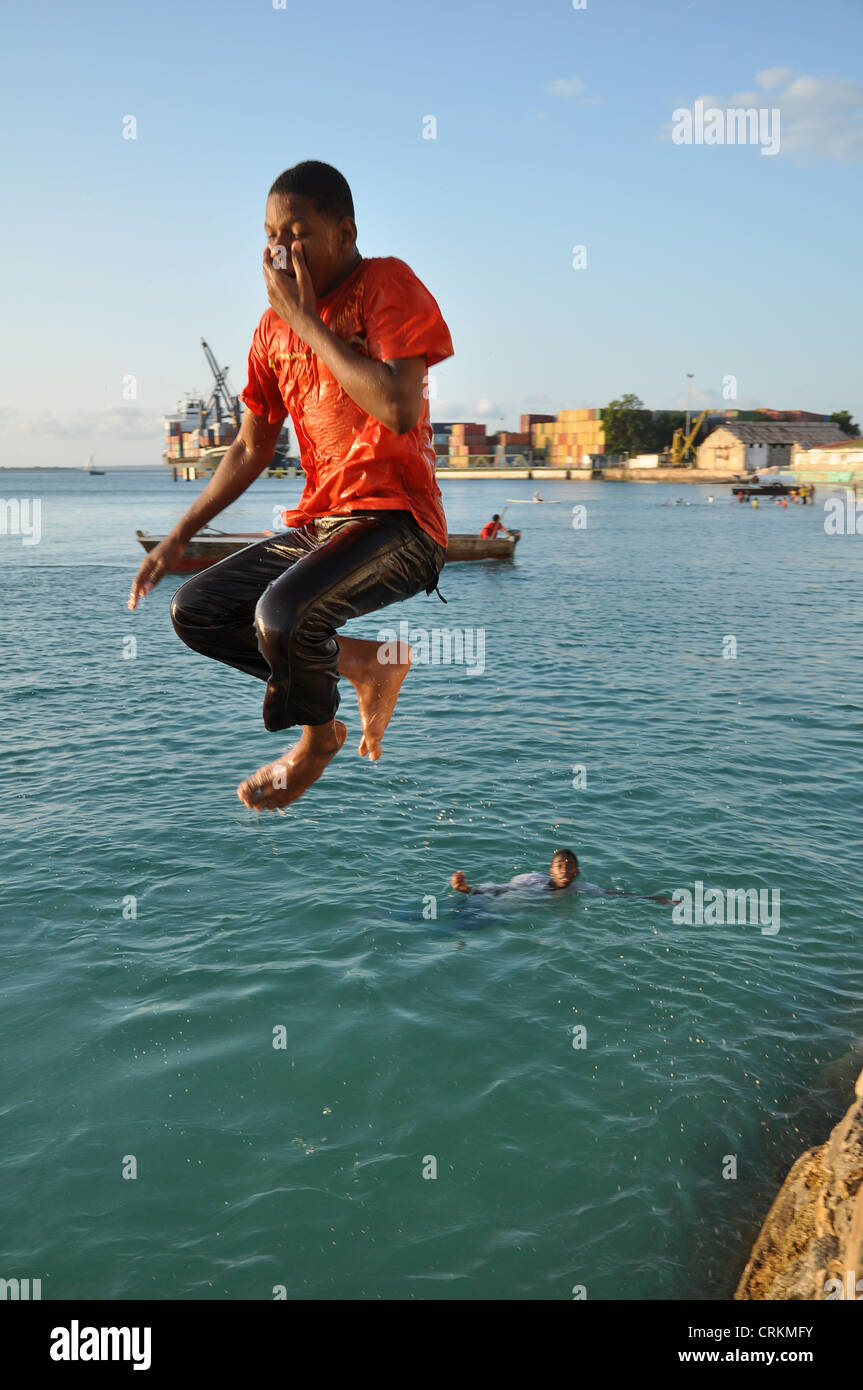 African boys diving in Stone town, zanzibar Stock Photo - Alamy
