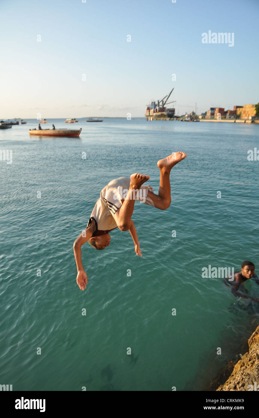 African boys diving in Stone town, zanzibar Stock Photo - Alamy