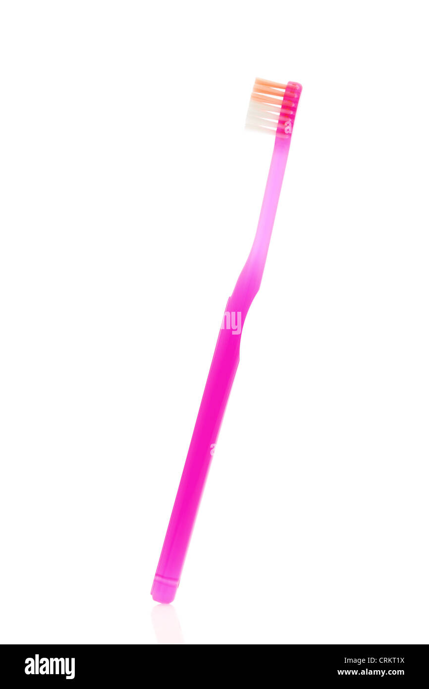 Pink toothbrush on white background Stock Photo - Alamy