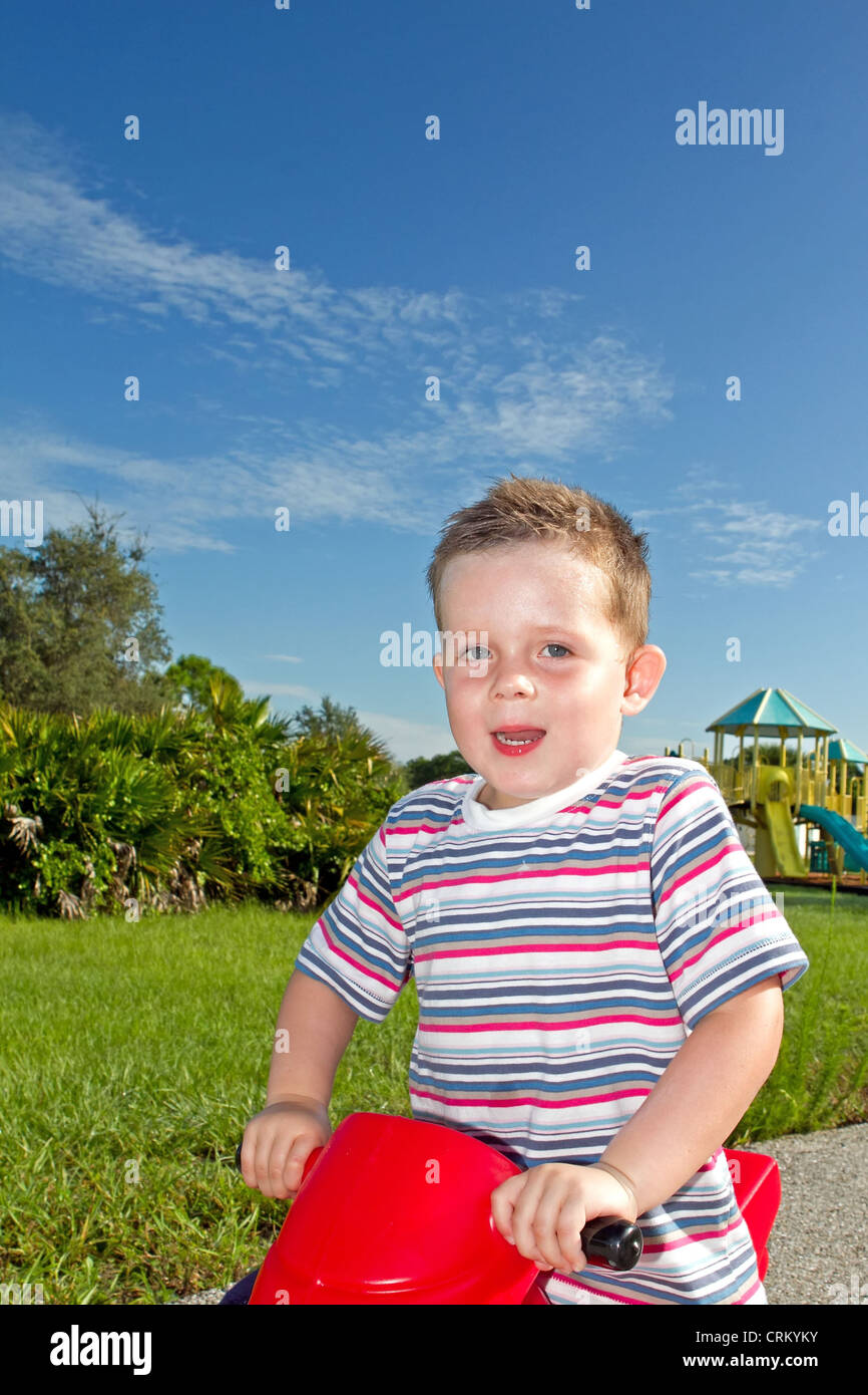 little boys racing on the toy motorbikes Stock Photo - Alamy