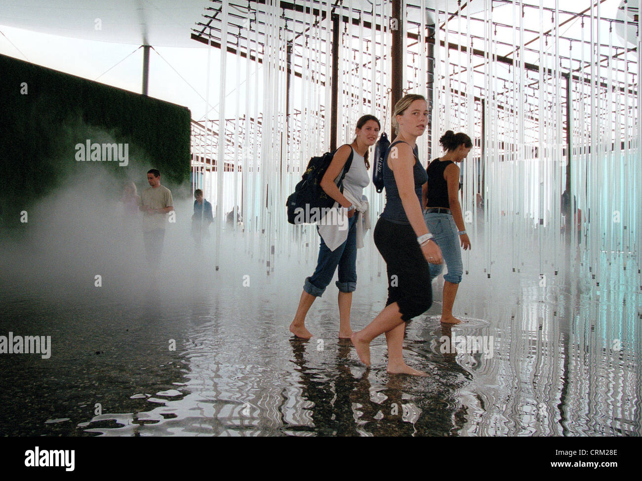 Expo 2002 visitors walk barefoot through a Ausstellunspavillon Stock ...