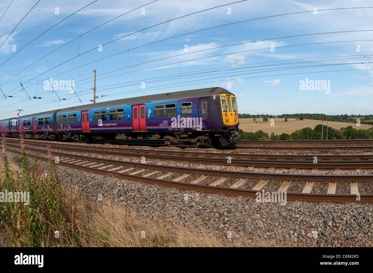 Passenger train in First Capital Connect livery speeding through the ...