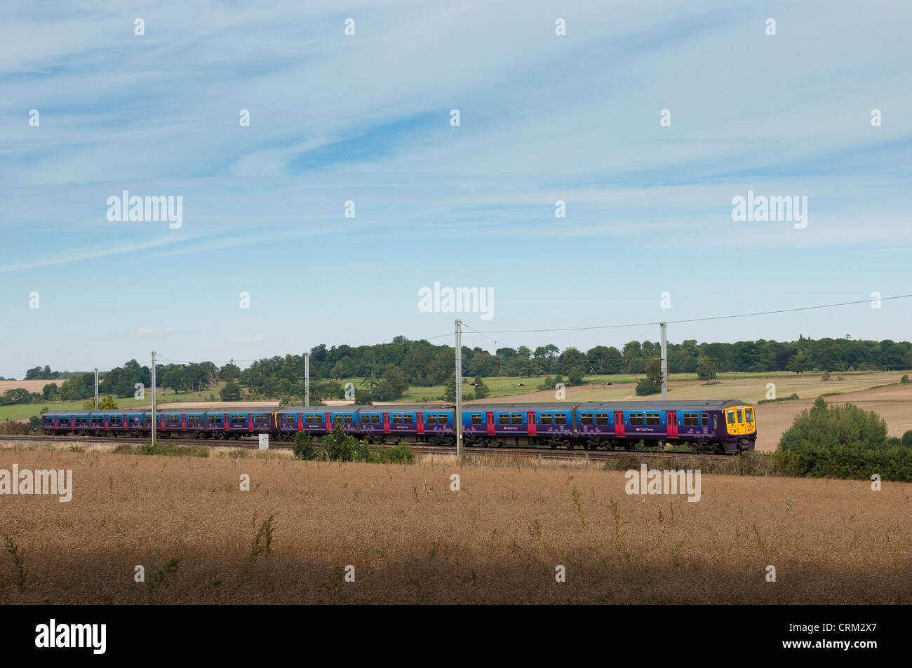 Passenger train in First Capital Connect livery speeding through the ...