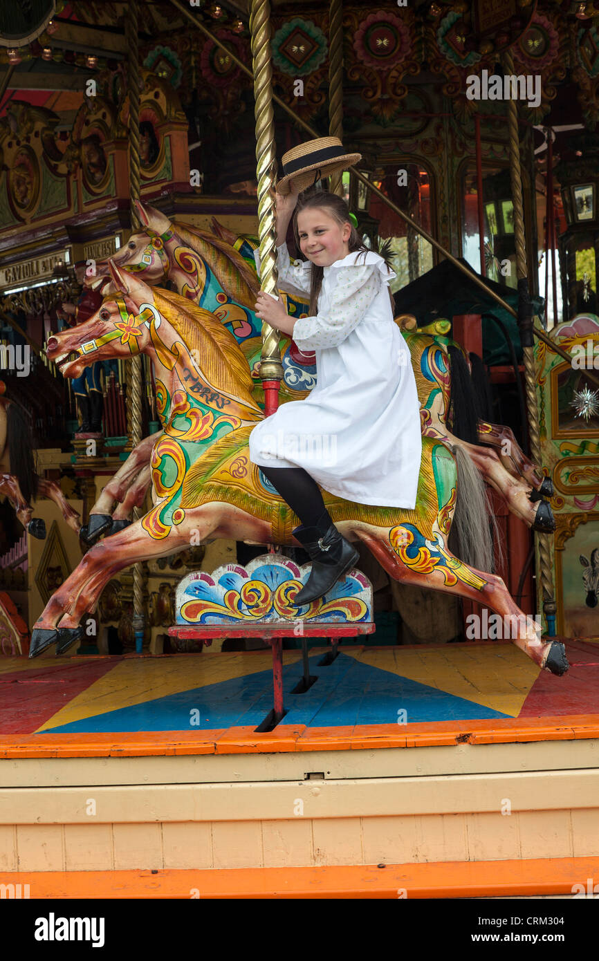 Girl on Carousel, Beamish Open Air Museum, County Durham Stock Photo ...