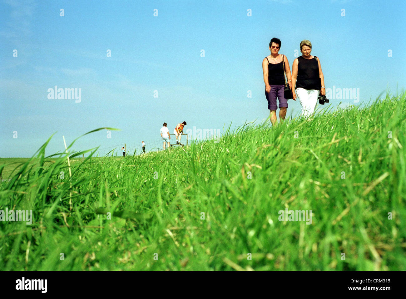 Walkers on the dike hi-res stock photography and images - Alamy