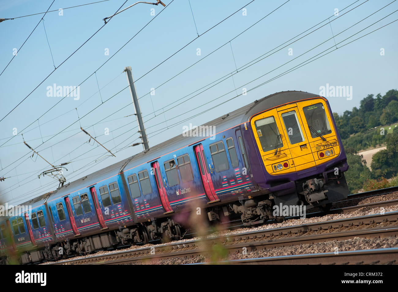 Passenger train in First Capital Connect livery speeding through the ...