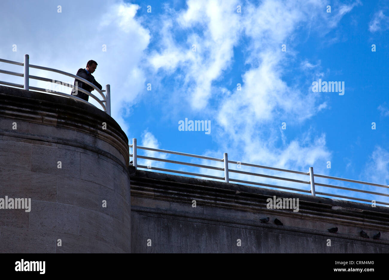 Silhouette man leaning on railings hi-res stock photography and images ...