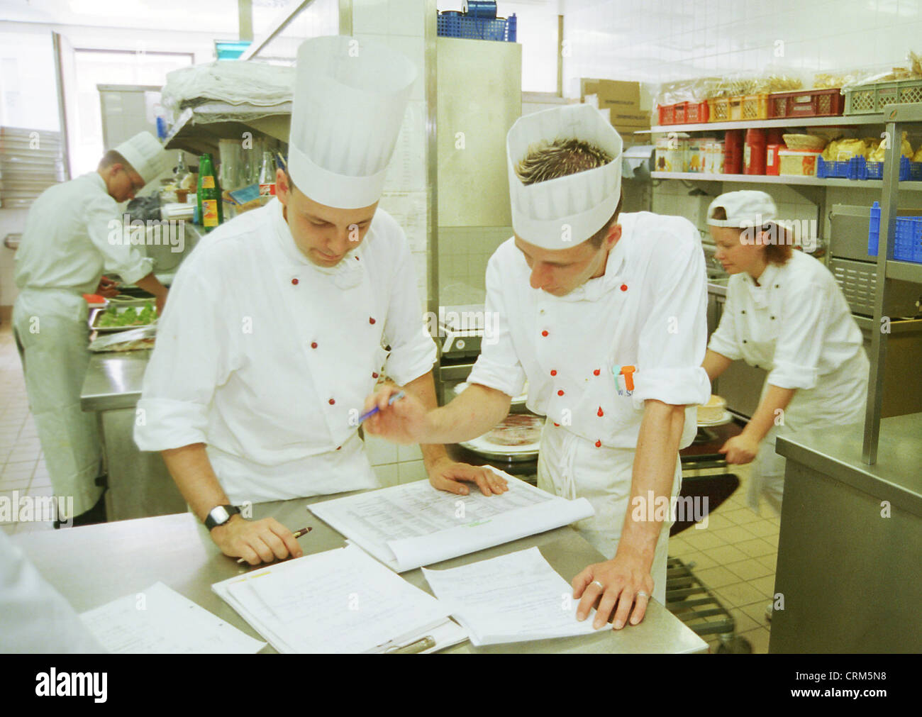 Chefs in Hotelkueche, professional Stock Photo - Alamy