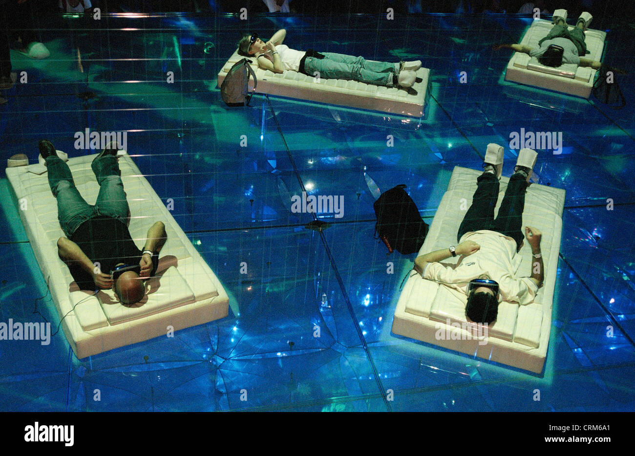 Expo 2002 visitors experience cyberspace lying on mattresses Stock ...