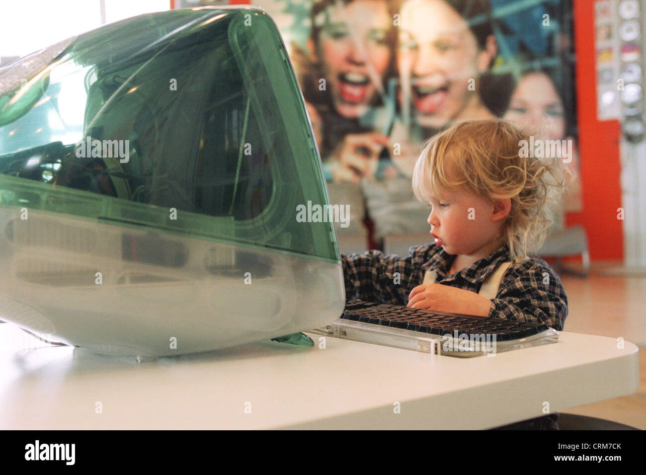 A little boy sits in front of a computer Stock Photo - Alamy