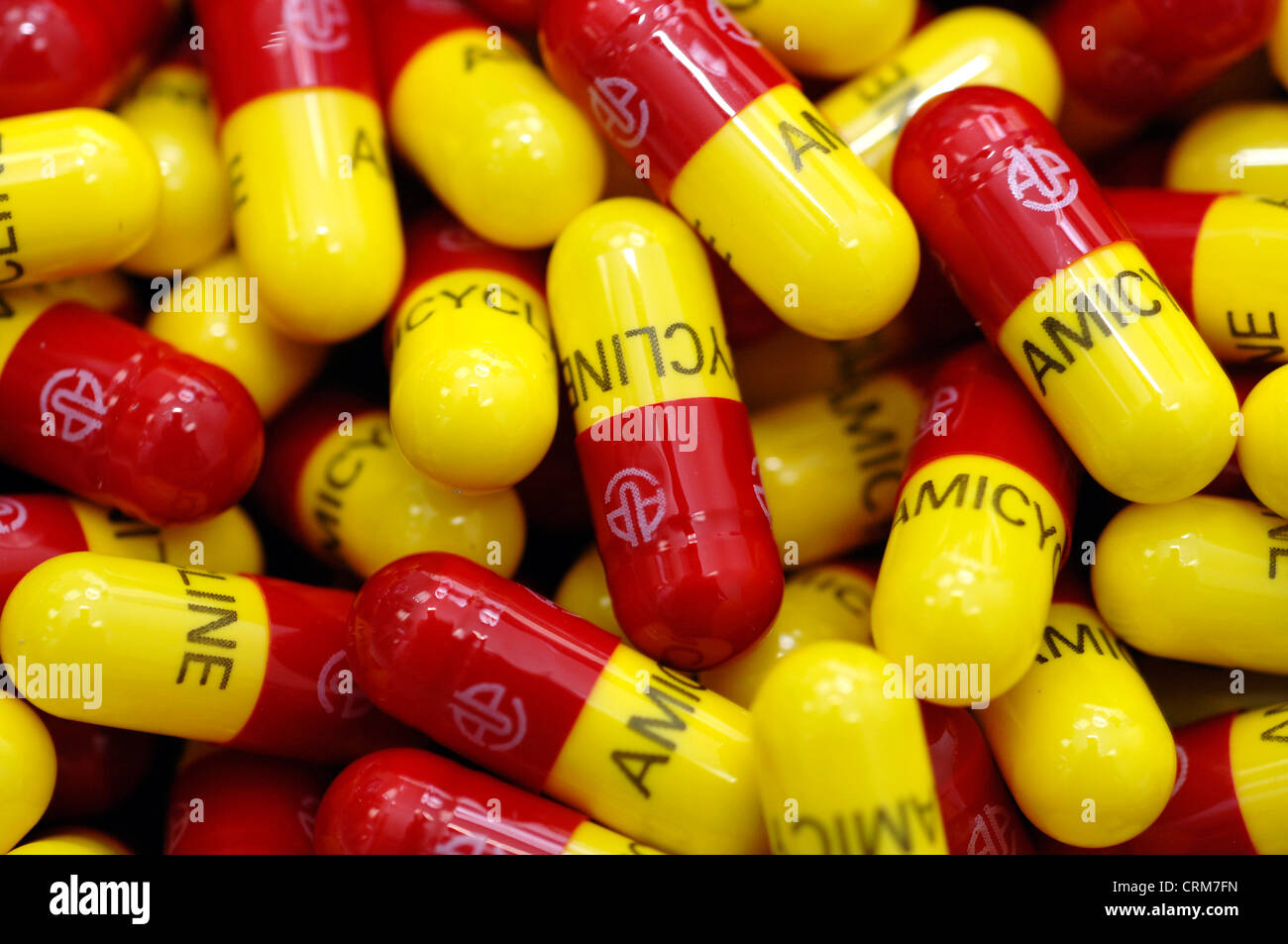 Numerous yellow and red Amicycline capsules Stock Photo - Alamy