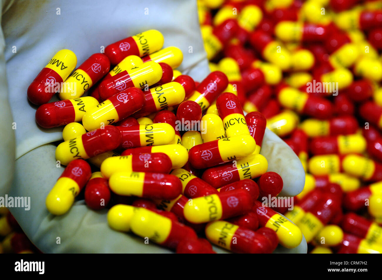 A handful of red and yellow Amicycline capsules Stock Photo - Alamy