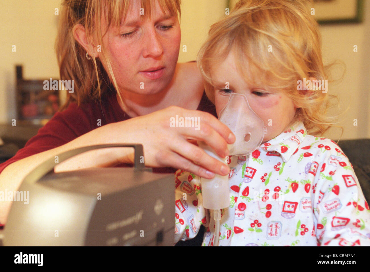 A mother helps her child during inhalation Stock Photo - Alamy A mother helps her child during inhalation Stock Photo - Alamy