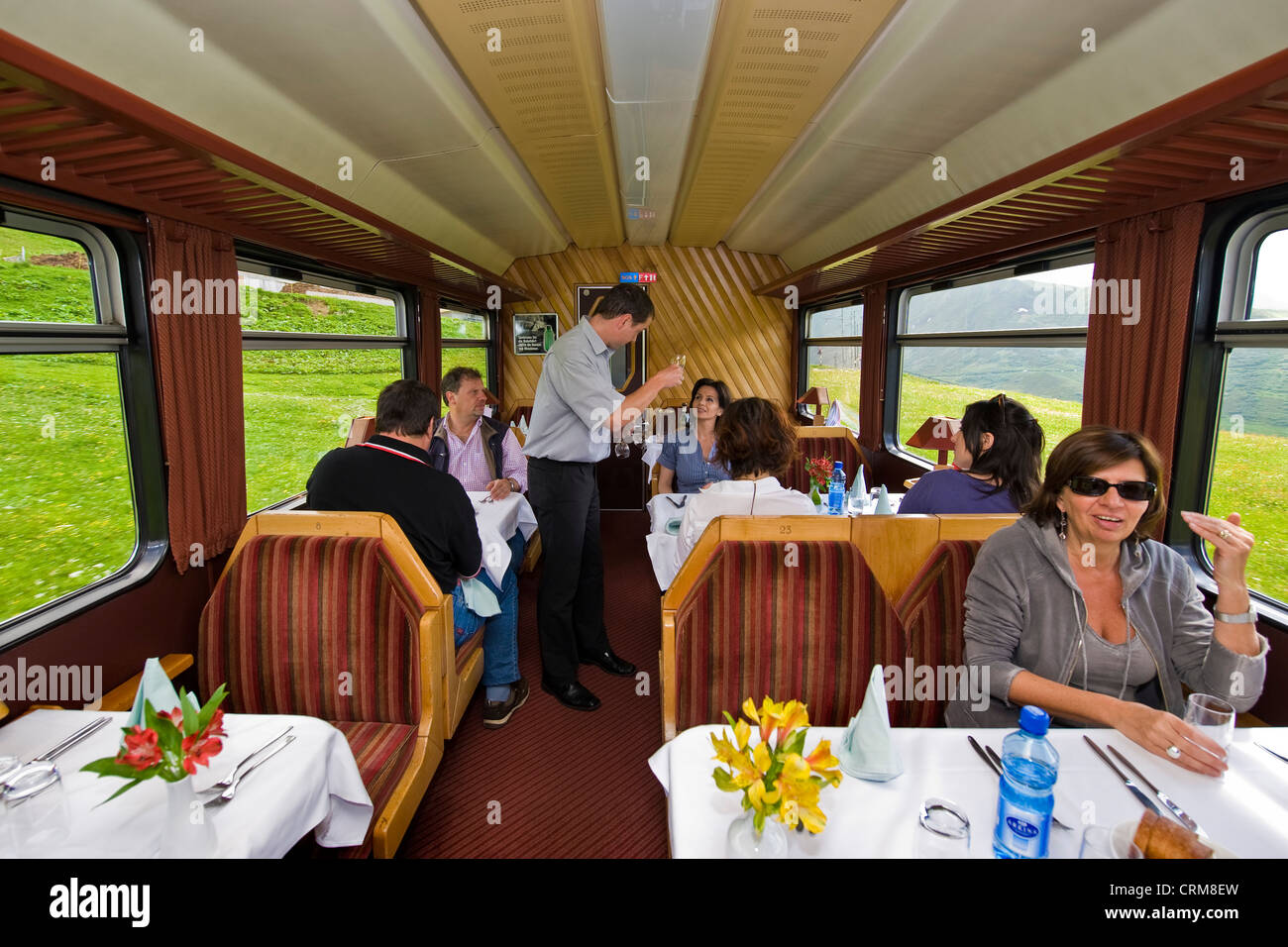 Switzerland, Canton Valais, Glacier express, lunch time in the dining ...