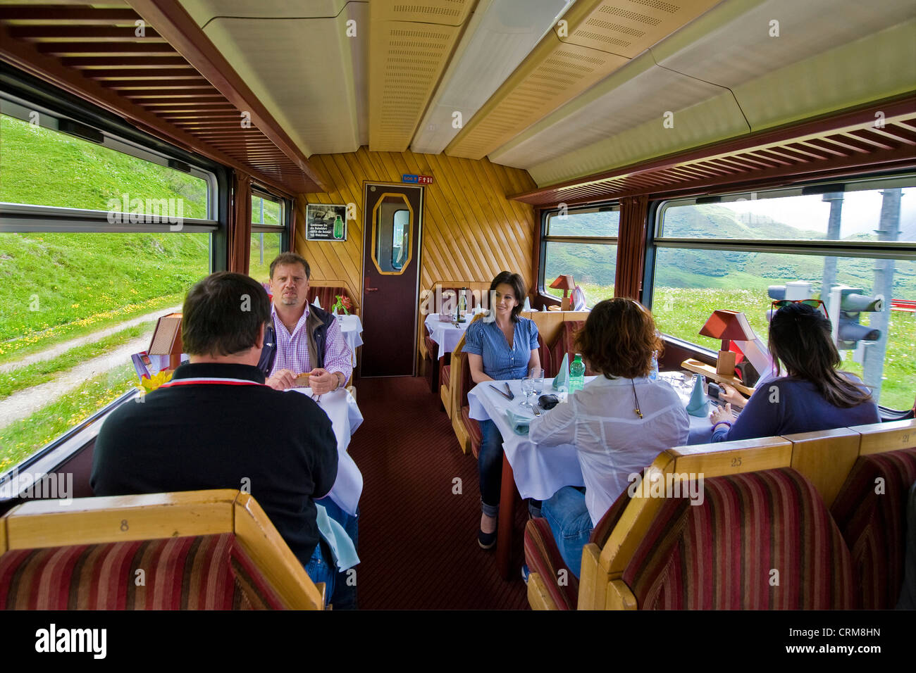Switzerland, Canton Valais, Glacier express, lunch time in the dining ...