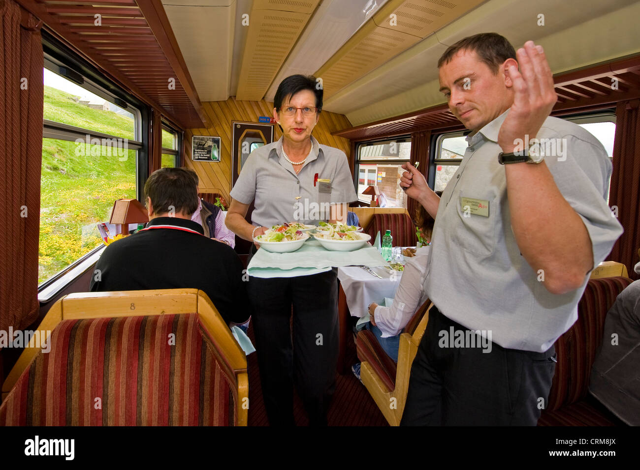 Switzerland, Canton Valais, Glacier express, lunch time in the dining ...