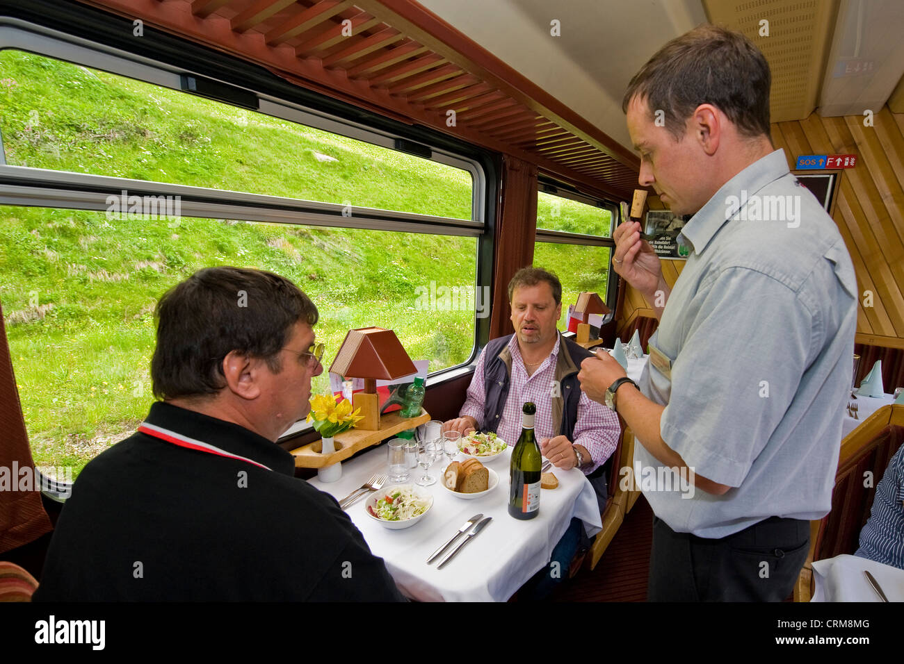 Switzerland, Canton Valais, Glacier express, lunch time in the dining ...