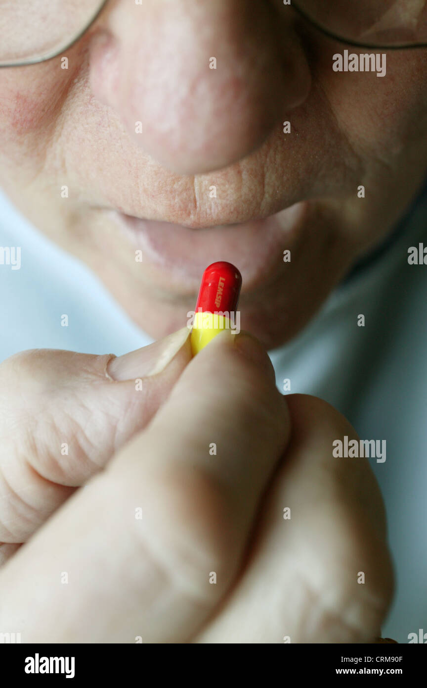 Yellow and red capsule hi-res stock photography and images - Alamy