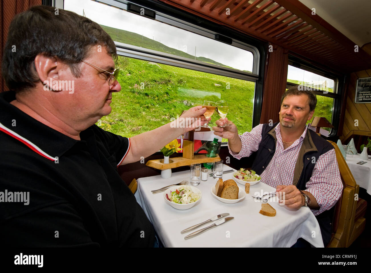 Switzerland, Canton Valais, Glacier express, lunch time in the dining ...