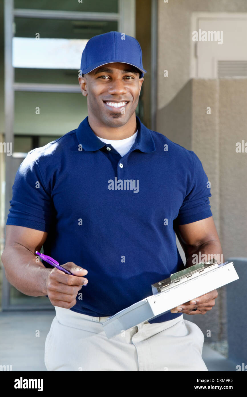 African young delivery man hi-res stock photography and images - Alamy