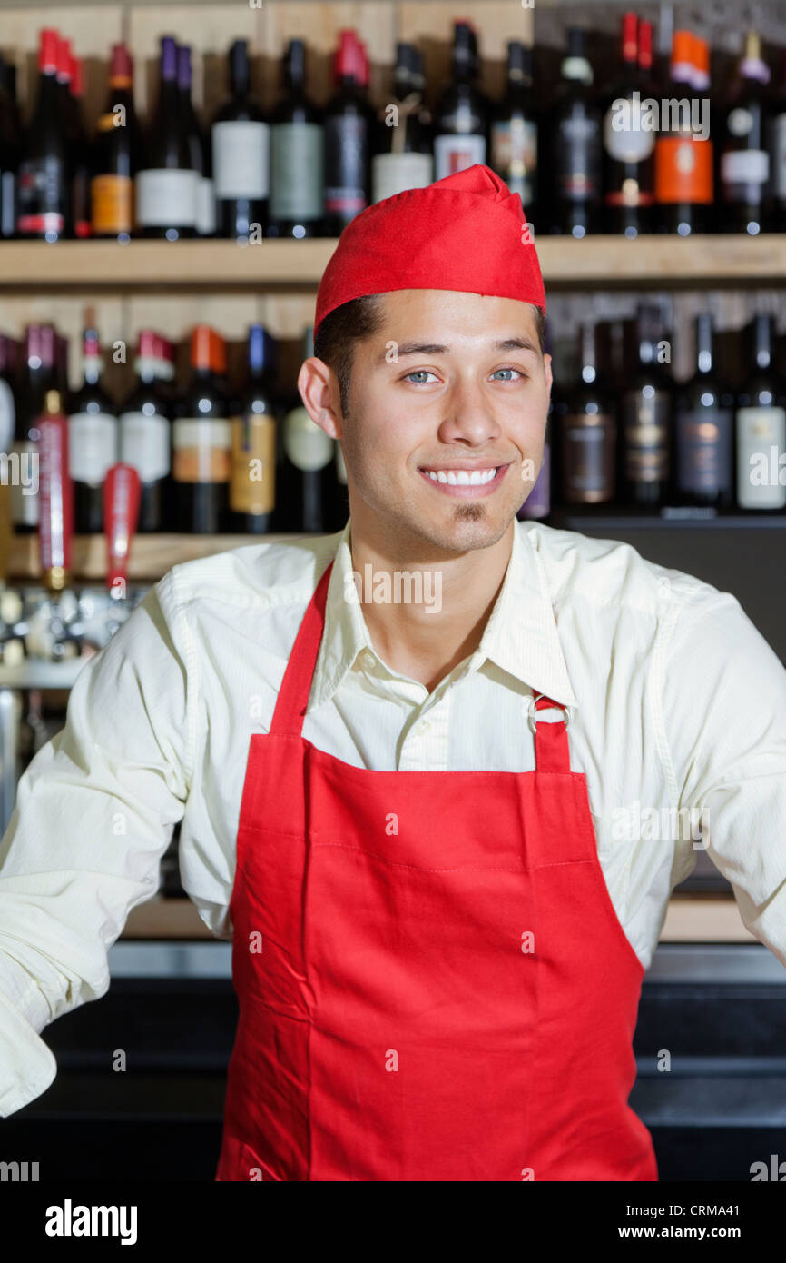 Portrait of a happy bartender in bar Stock Photo - Alamy