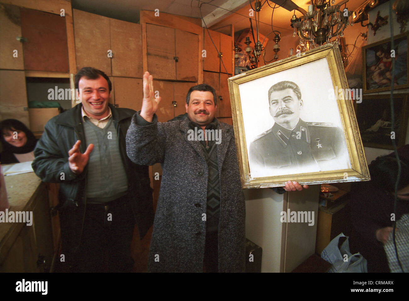 Dealer with Stalin's picture on Troedelmarkt in Tbilisi Stock Photo - Alamy