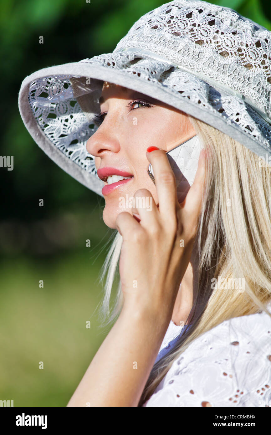 A beautiful young woman on a cell phone Stock Photo - Alamy