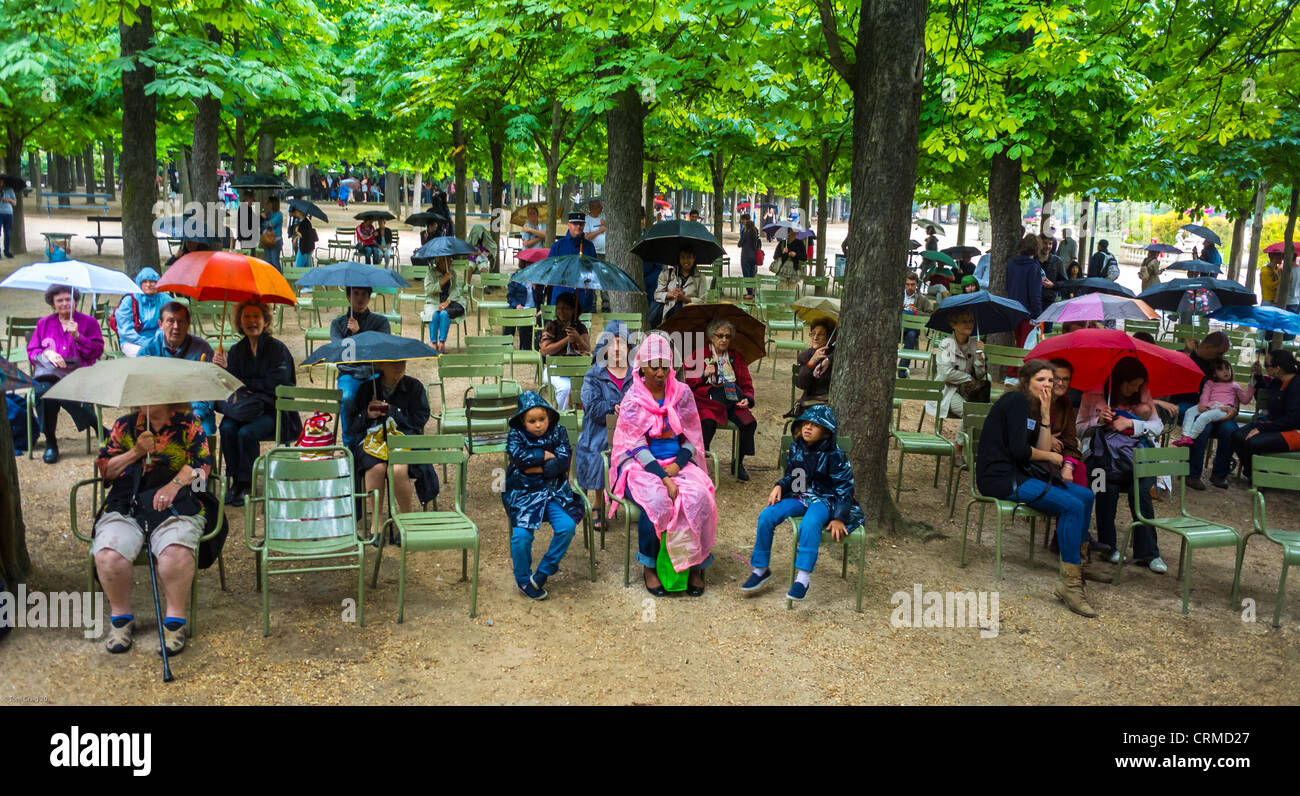 paris, France, French Audience Crowd, in Rain With Umbrellas Listening ...