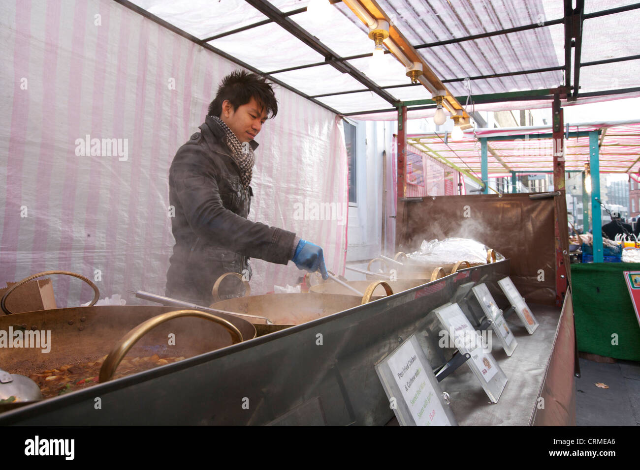 Young Asian man cooking Thai food Stock Photo - Alamy