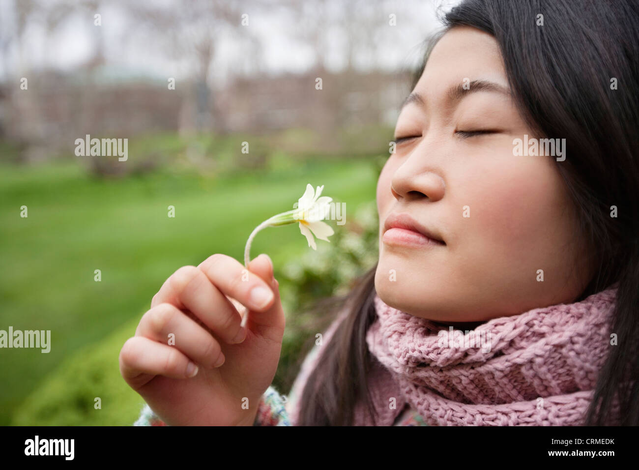 Asian woman smelling flower hi-res stock photography and images - Alamy