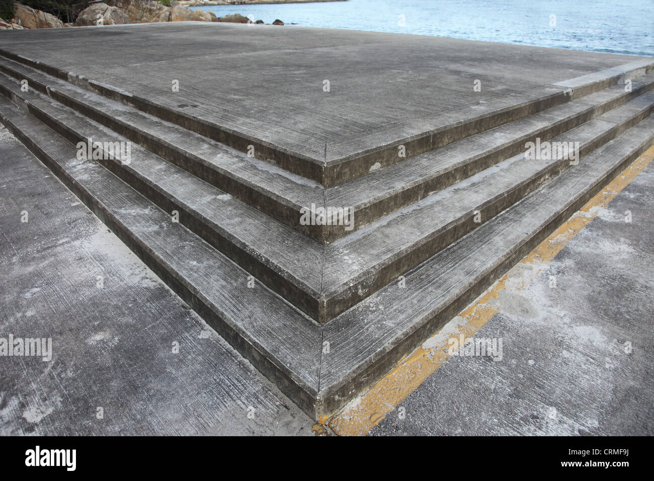 It's a photo of a platform with 4 steps. It's make of concrete and it's ...