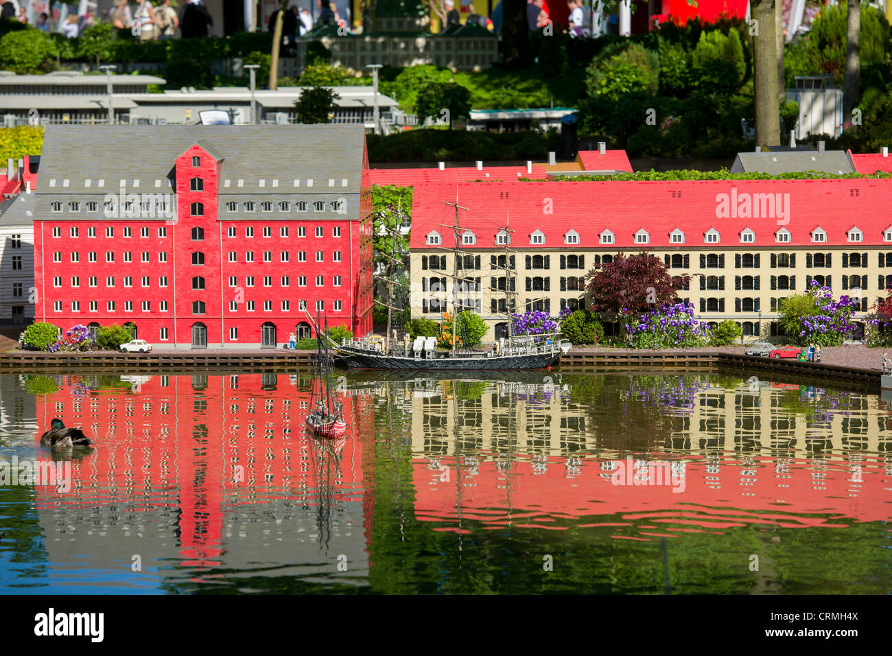 Red Lego buildings reflected in water, Miniland, Legoland, Billund ...