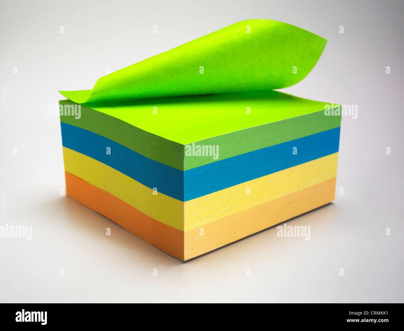 A block of coloured sticky notes, one folded back Stock Photo - Alamy