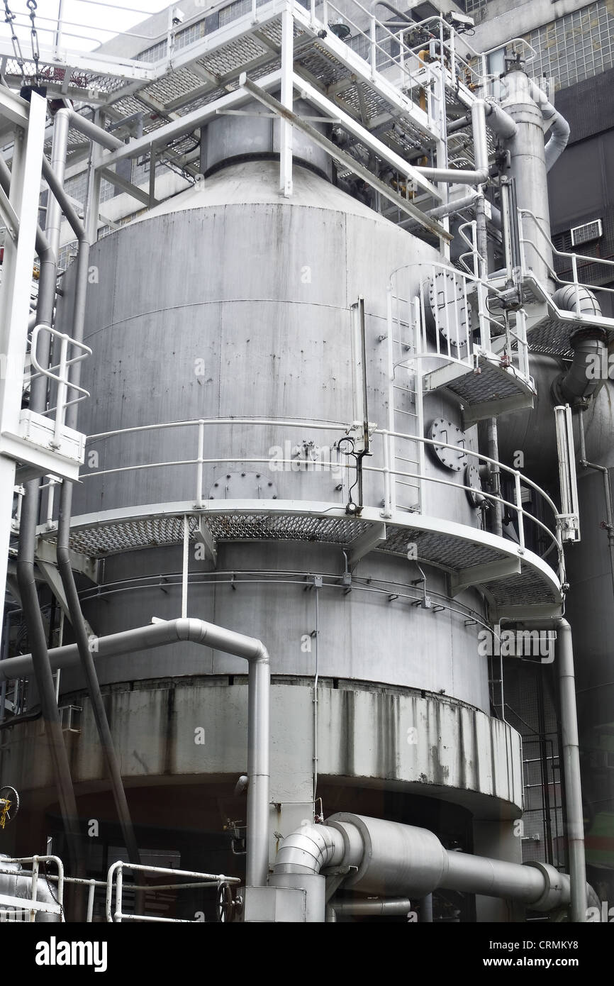 Pipes, tubes, machinery and steam turbine at a power plant Stock Photo ...