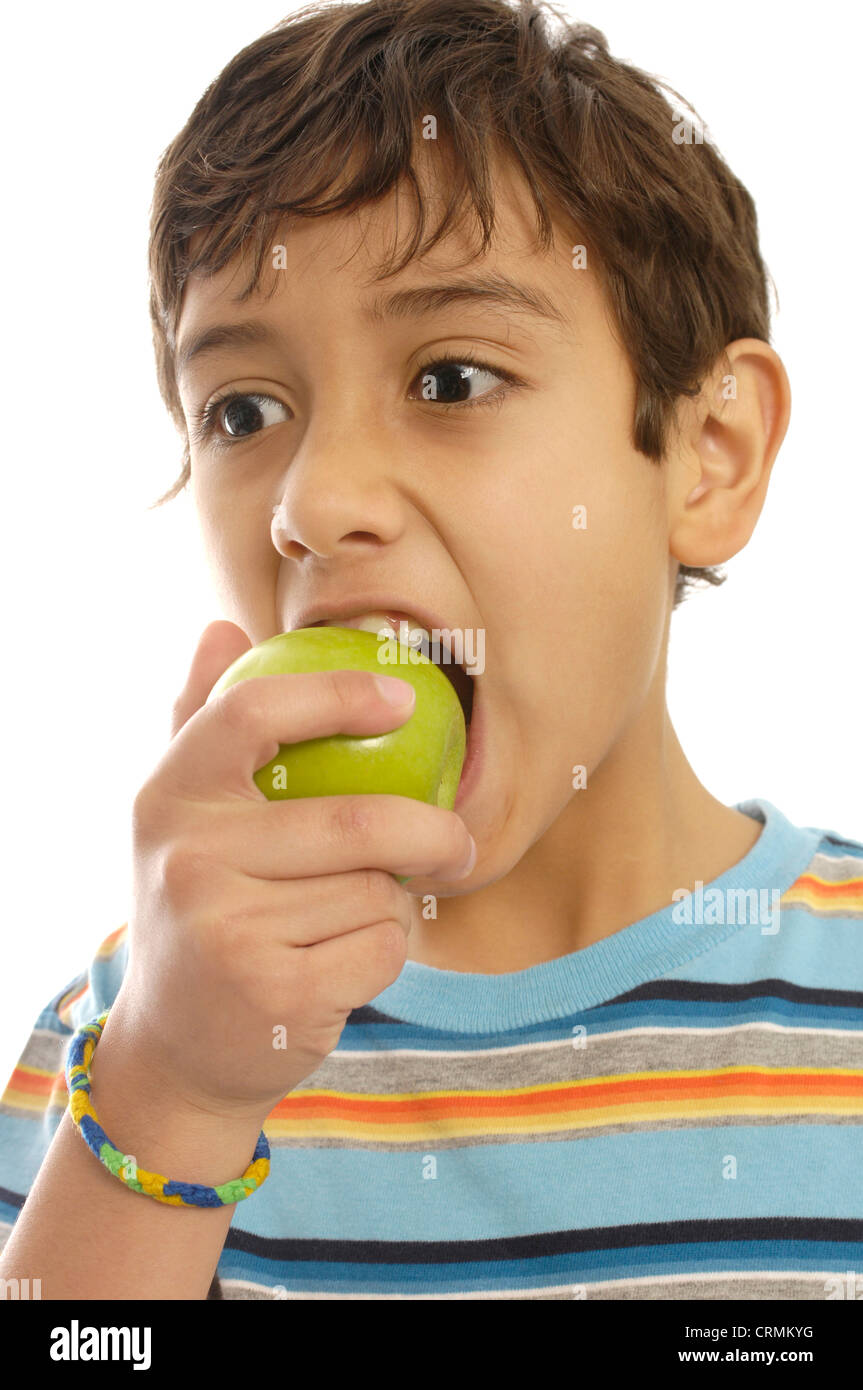 A young boy eating an apple Stock Photo - Alamy