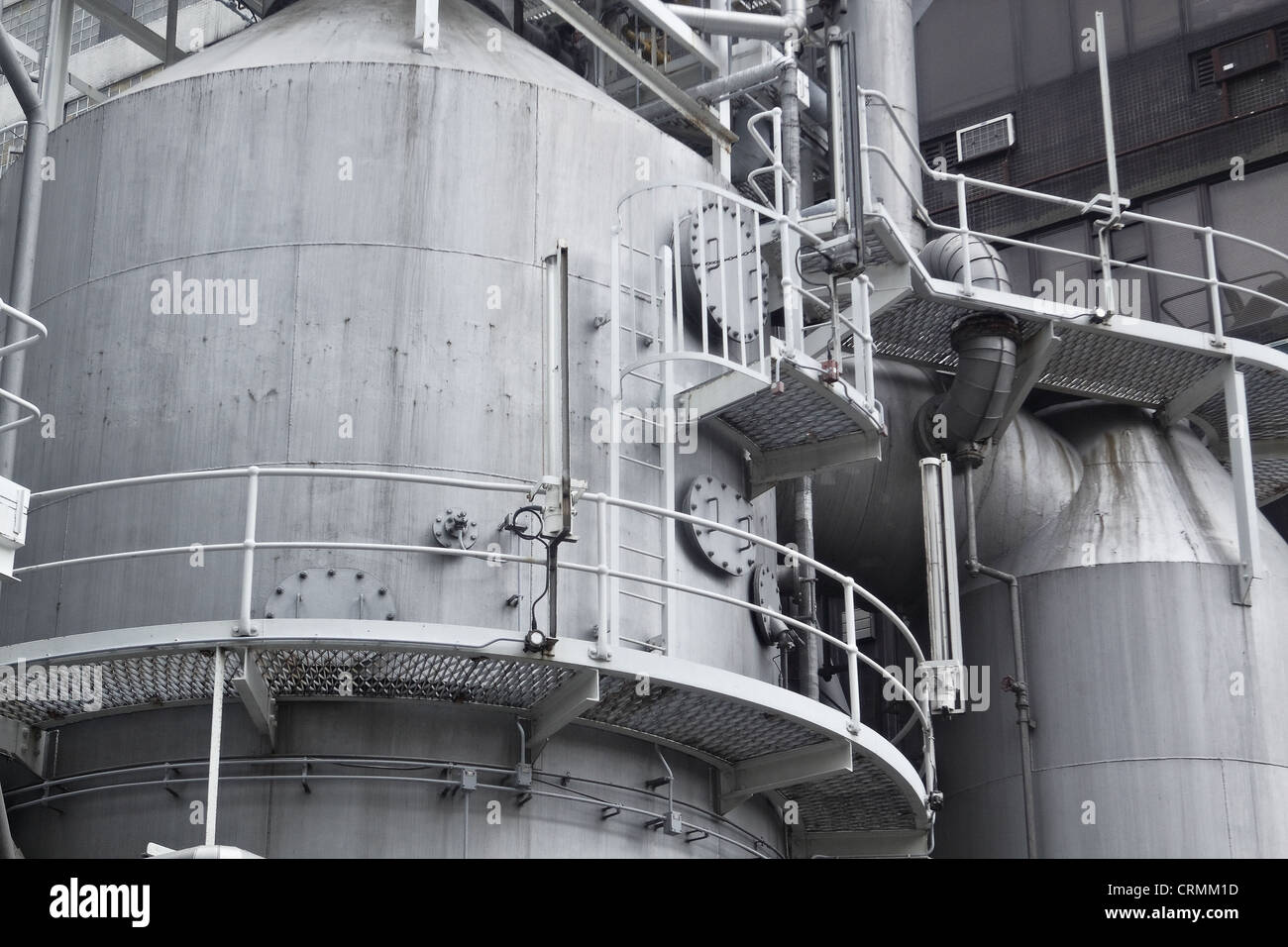 Pipes, tubes, machinery and steam turbine at a power plant Stock Photo ...