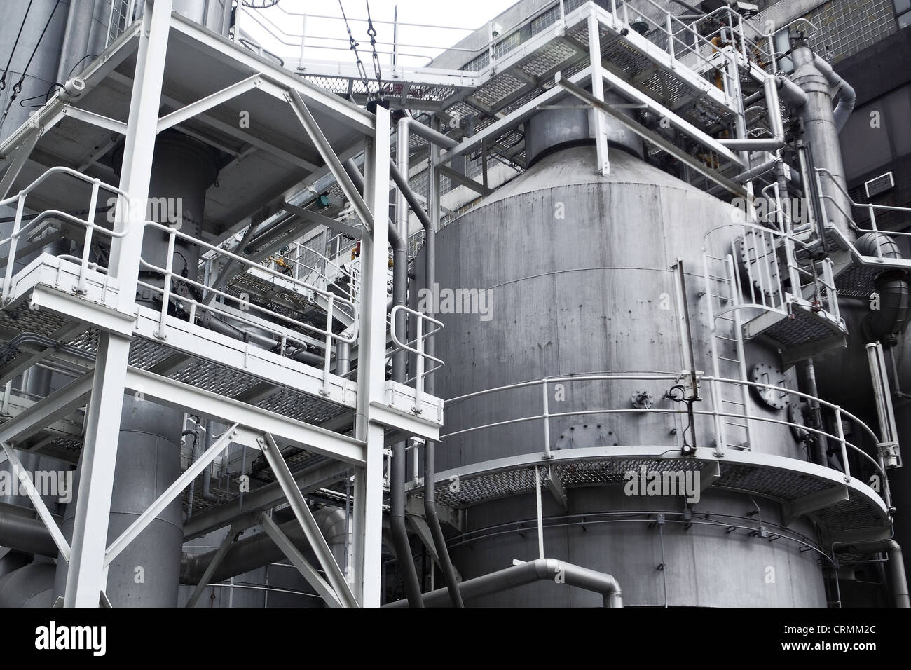 Pipes, tubes, machinery and steam turbine at a power plant Stock Photo ...