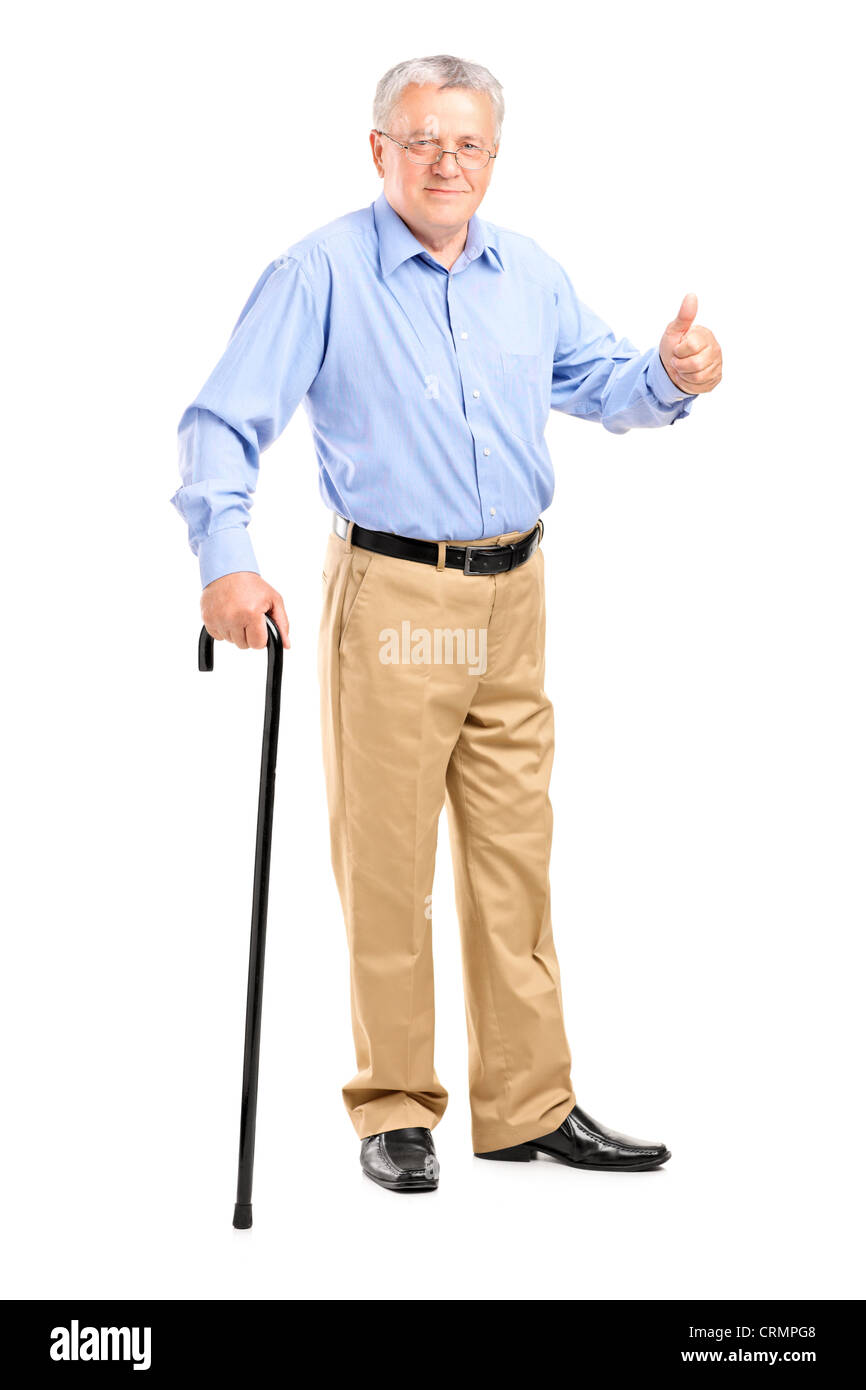 Senior man walking with cane and giving a thumb up, isolated on white ...