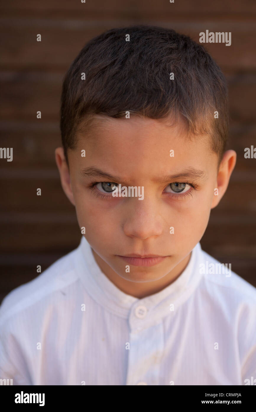 little boy with serious expression Stock Photo - Alamy