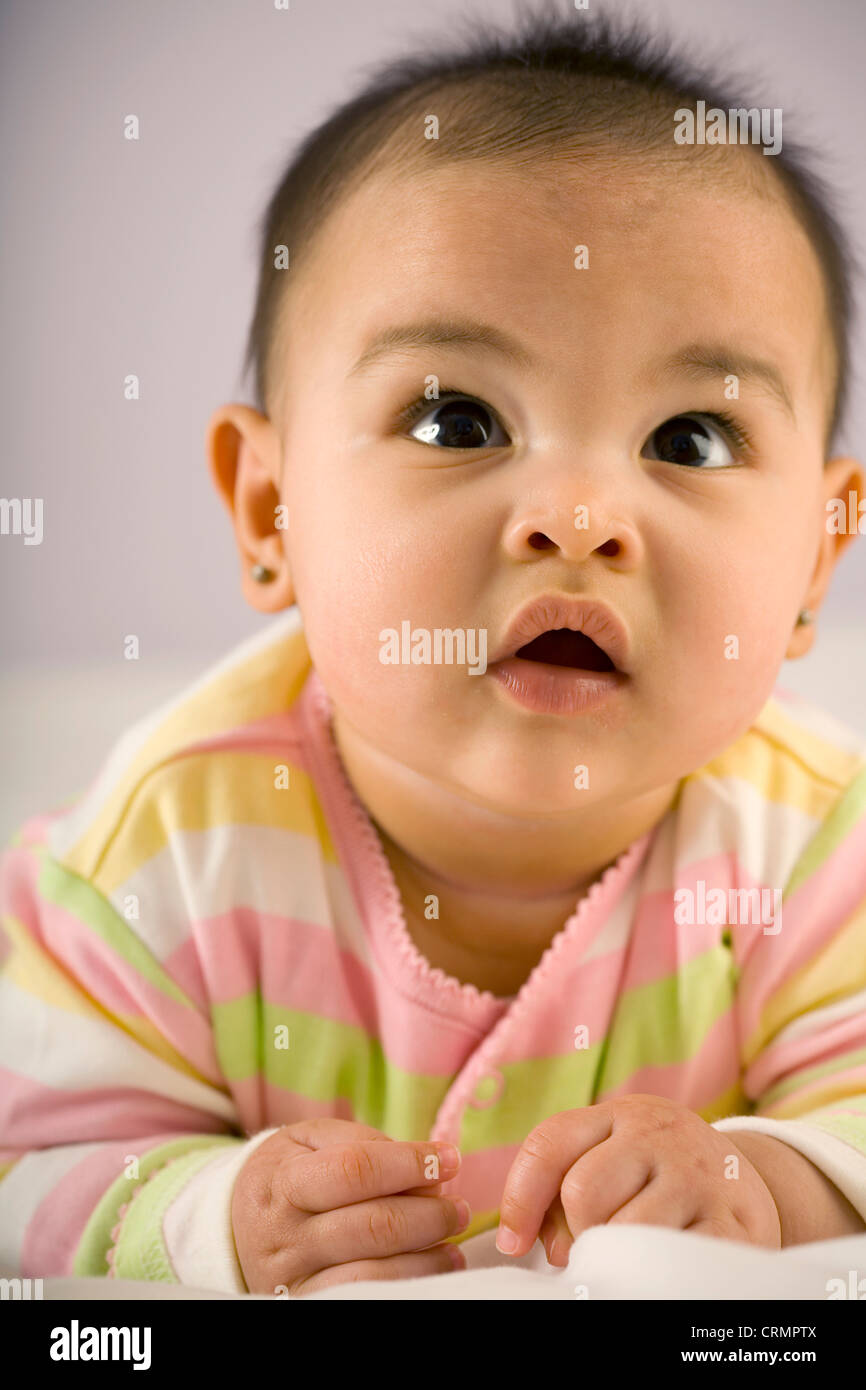 A happy playful baby girl Stock Photo - Alamy