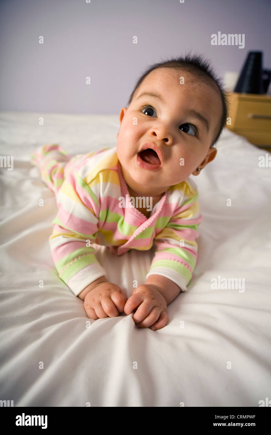 A happy playful baby girl Stock Photo - Alamy