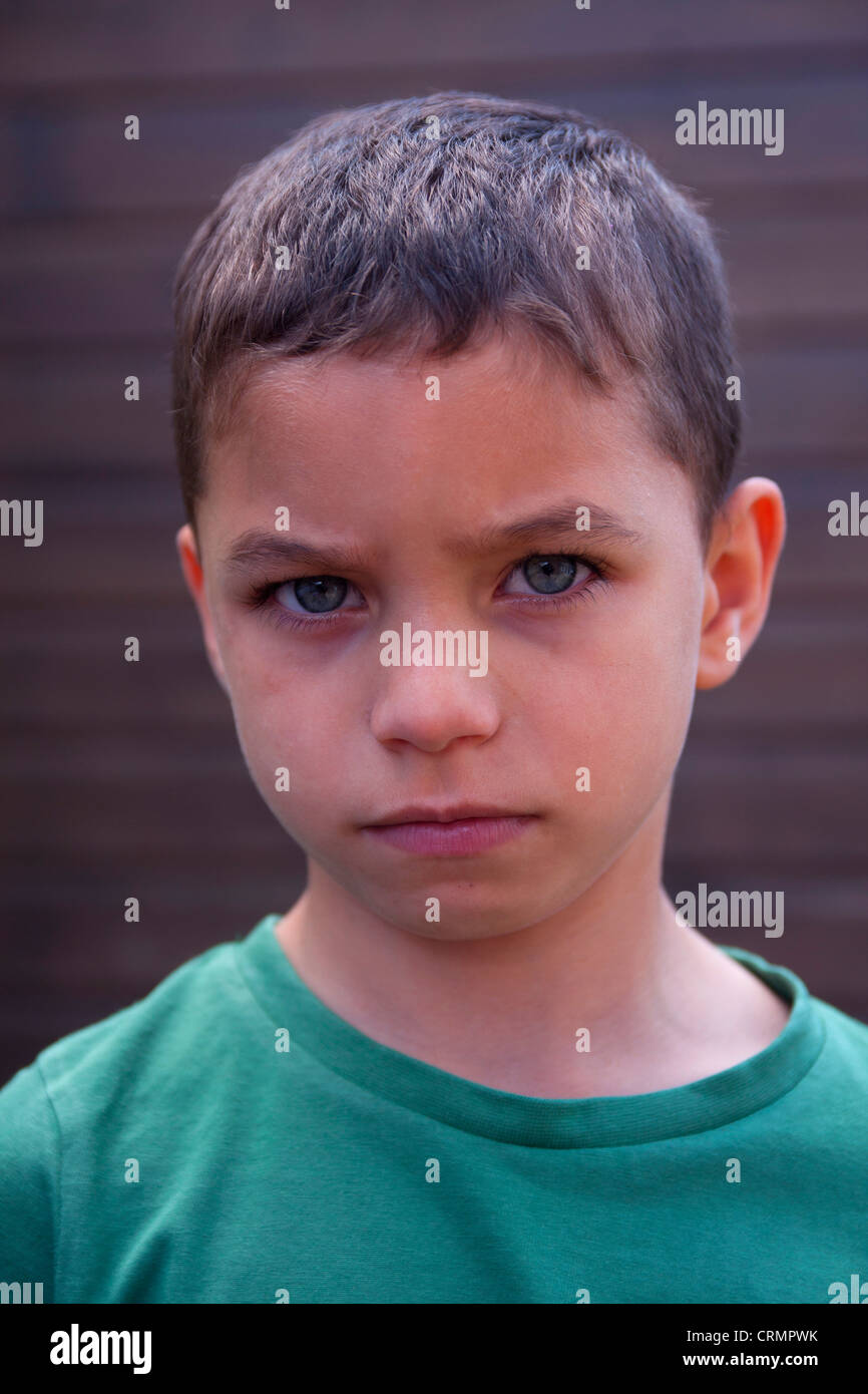 little boy with serious expression Stock Photo - Alamy