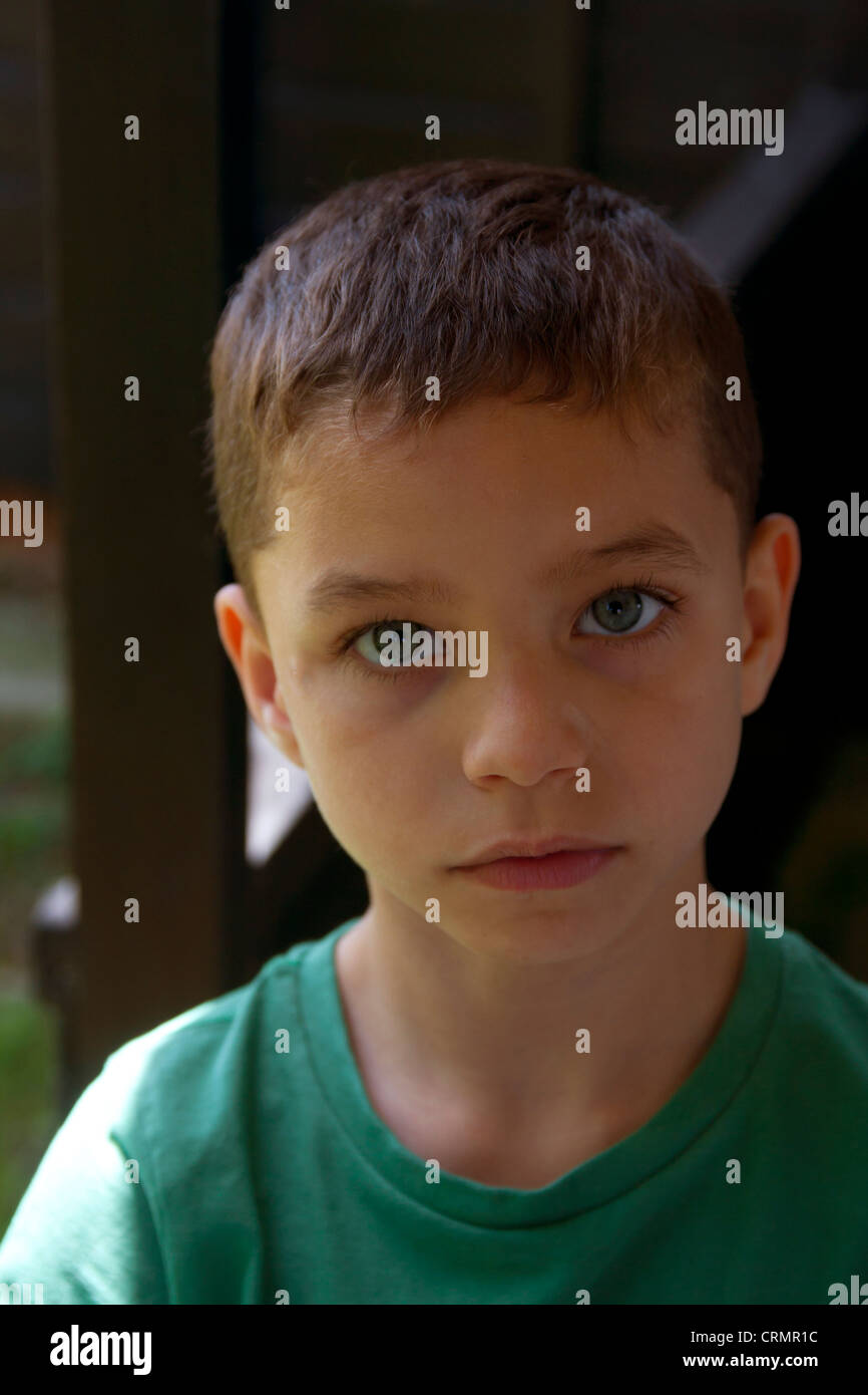 little boy with serious expression Stock Photo - Alamy