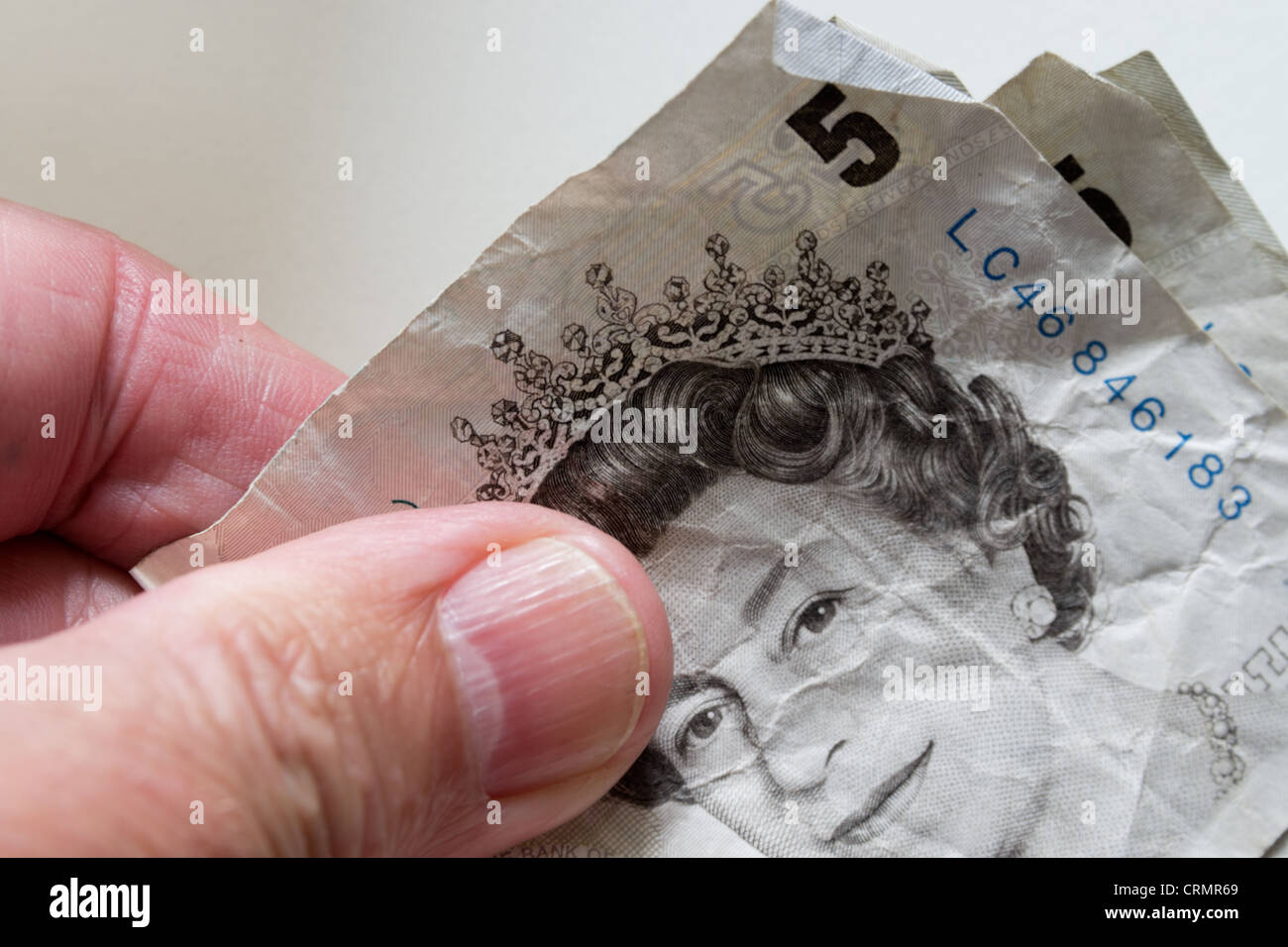 English currency paper money notes of £5 denomination folded and ...